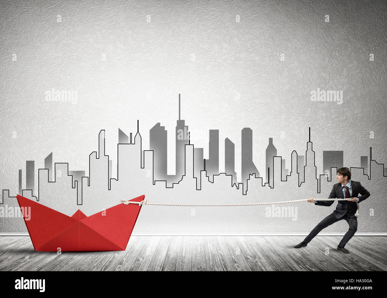 Successful businessman pulling with rope paper boat Stock Photo - Alamy