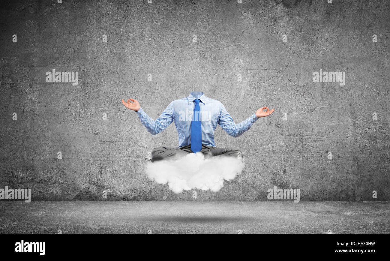 Headless businessman sitting on cloud in lotus pose and meditating ...