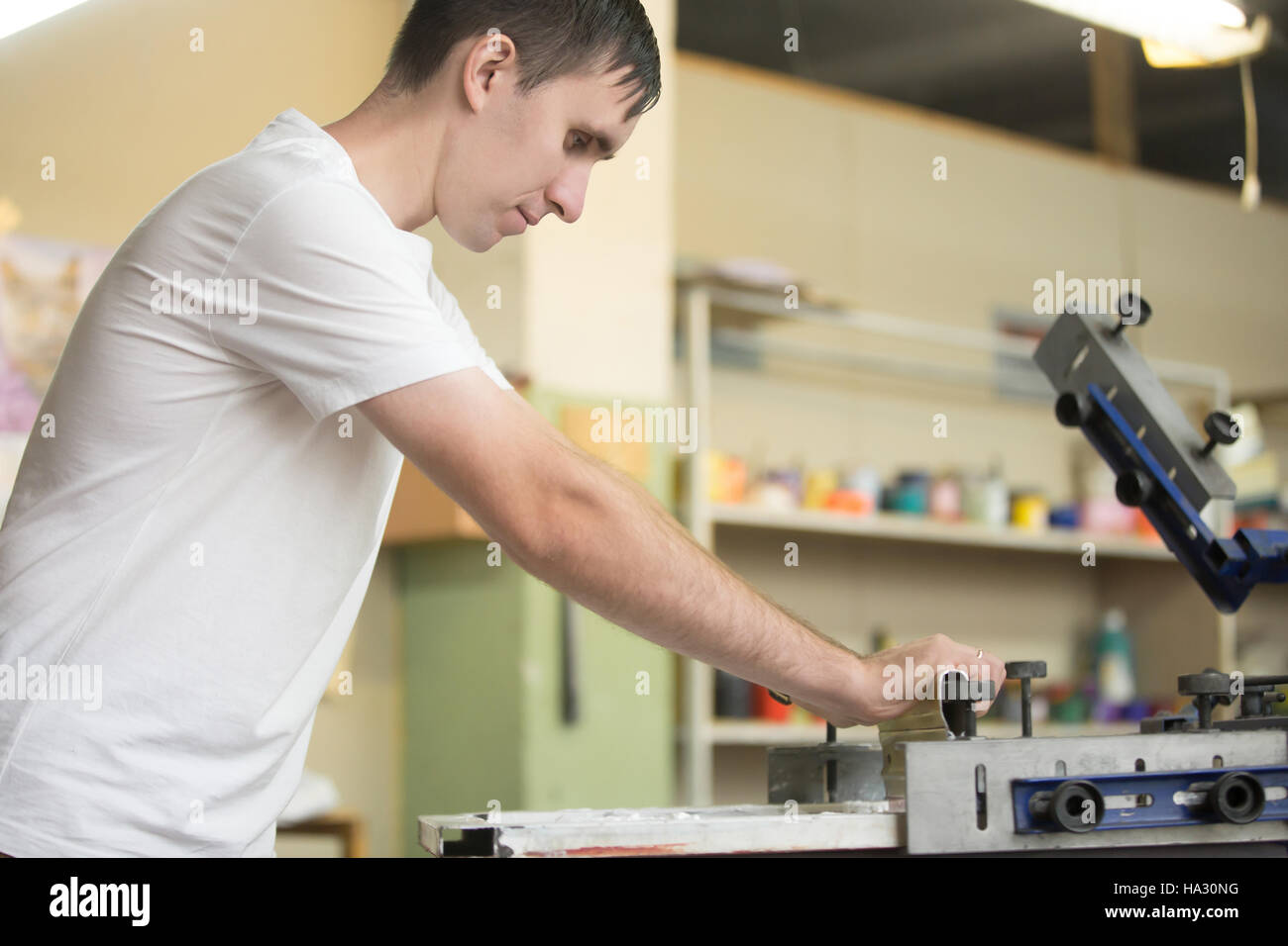 Young man screen printing Stock Photo - Alamy