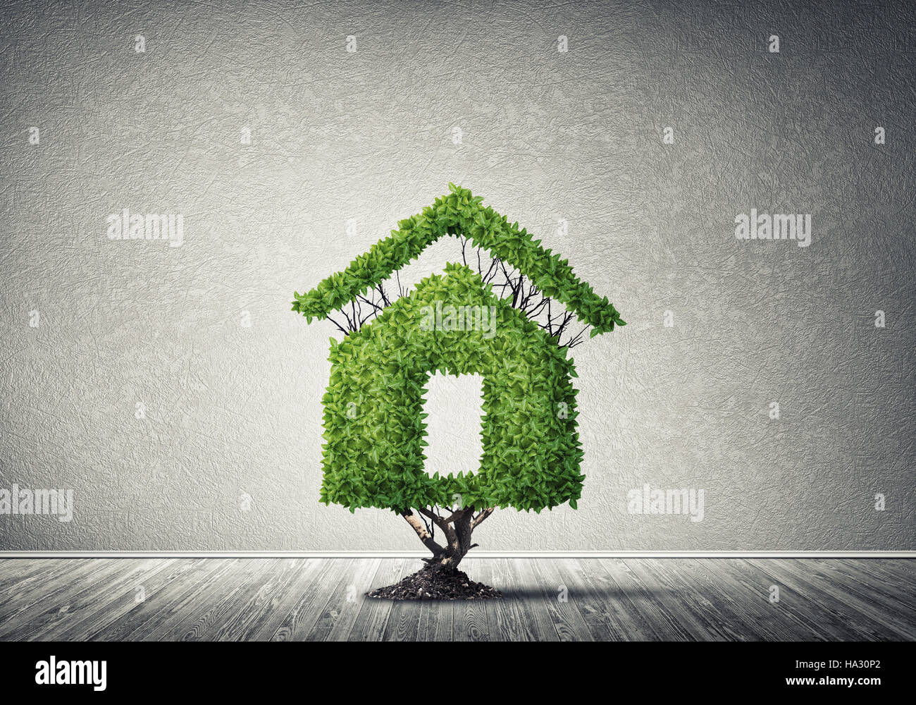 House shaped green tree as real estate concept Stock Photo - Alamy