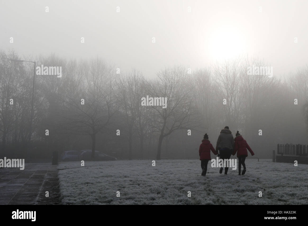 People walk through mist on gateacre estate hi-res stock photography ...