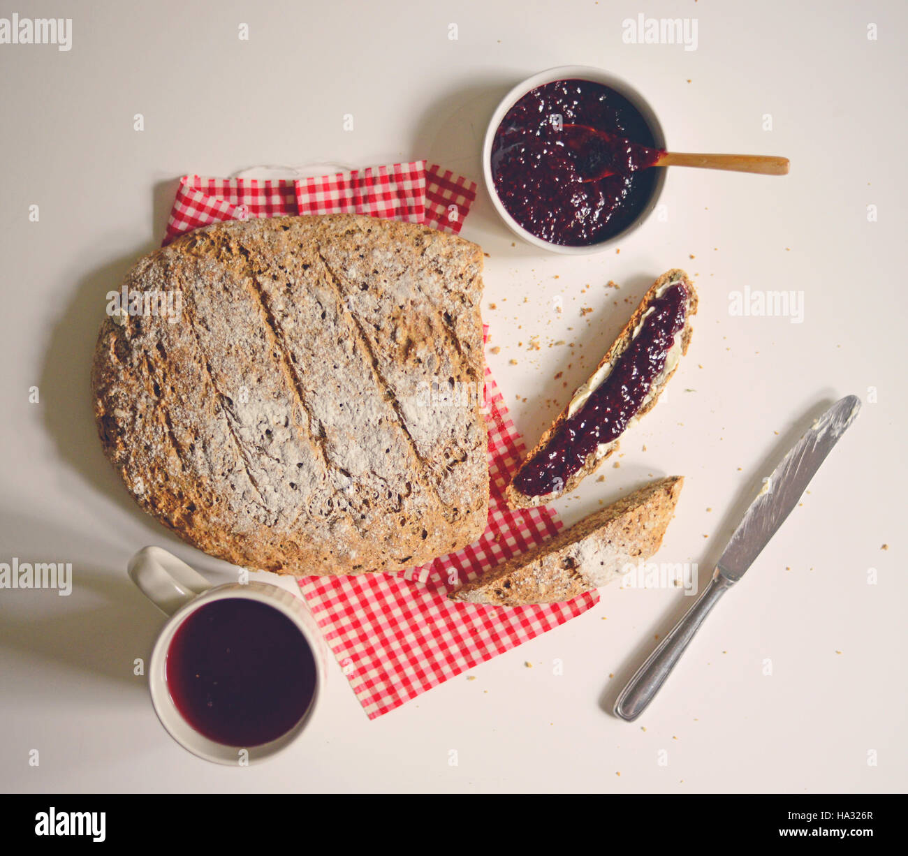 Home made bread with raspberry jam and coffee cup - Flat lay Stock ...