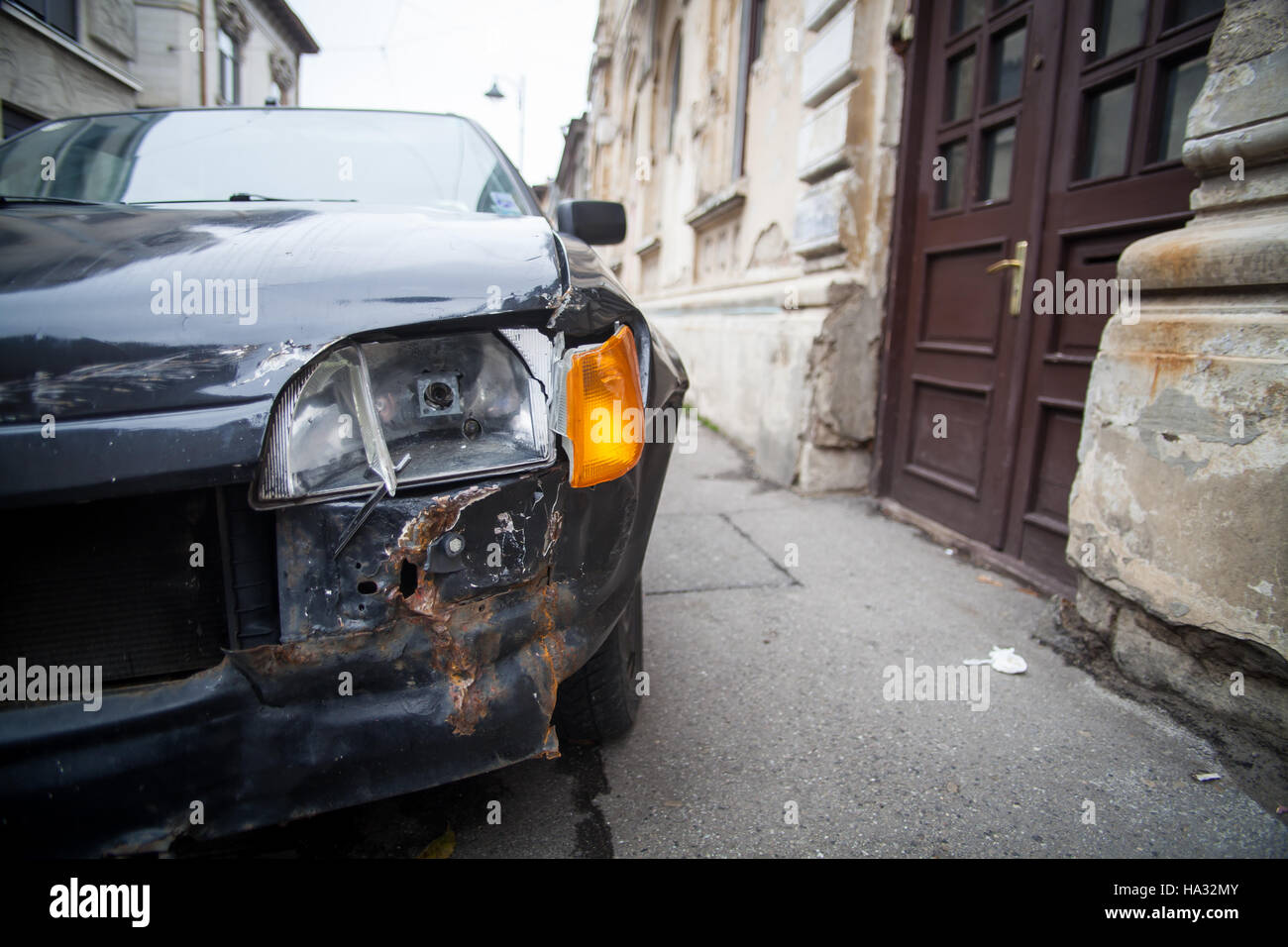Color image of a crashed car with broken headlight Stock Photo - Alamy
