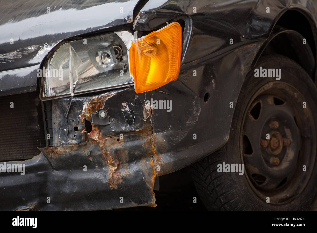Color image of a crashed car with broken headlight Stock Photo - Alamy