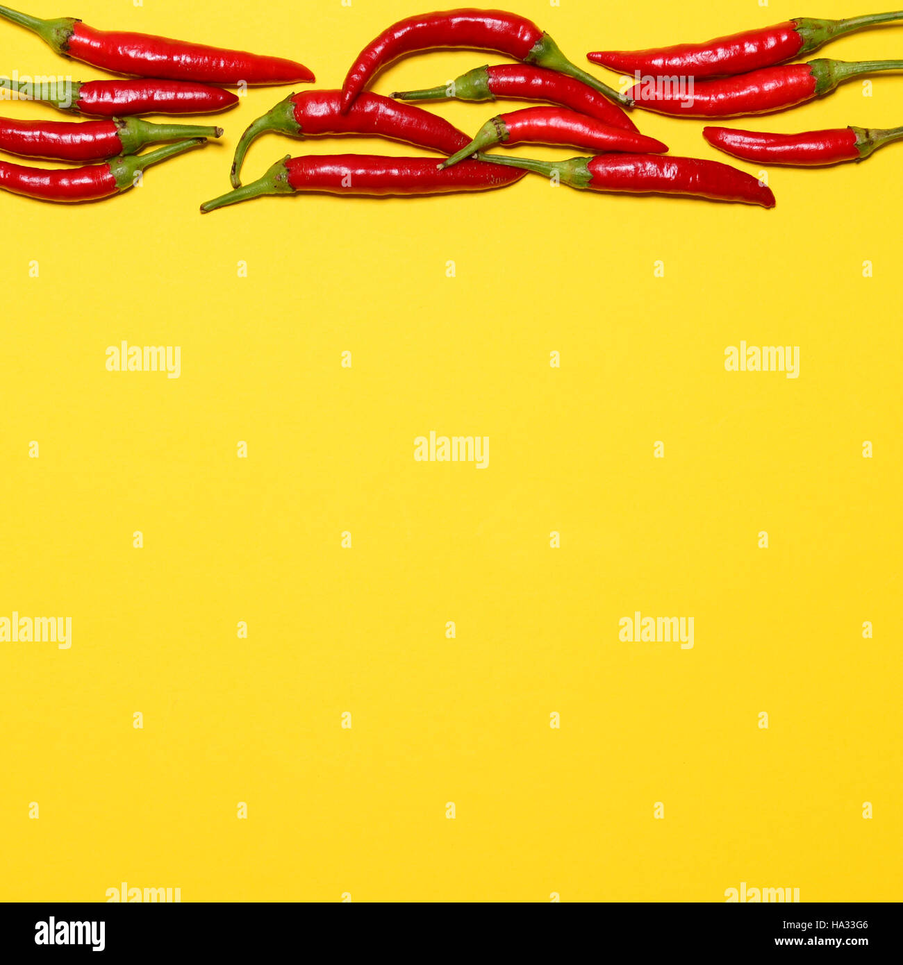 Red hot chili peppers on yellow background - Flat lay Stock Photo - Alamy