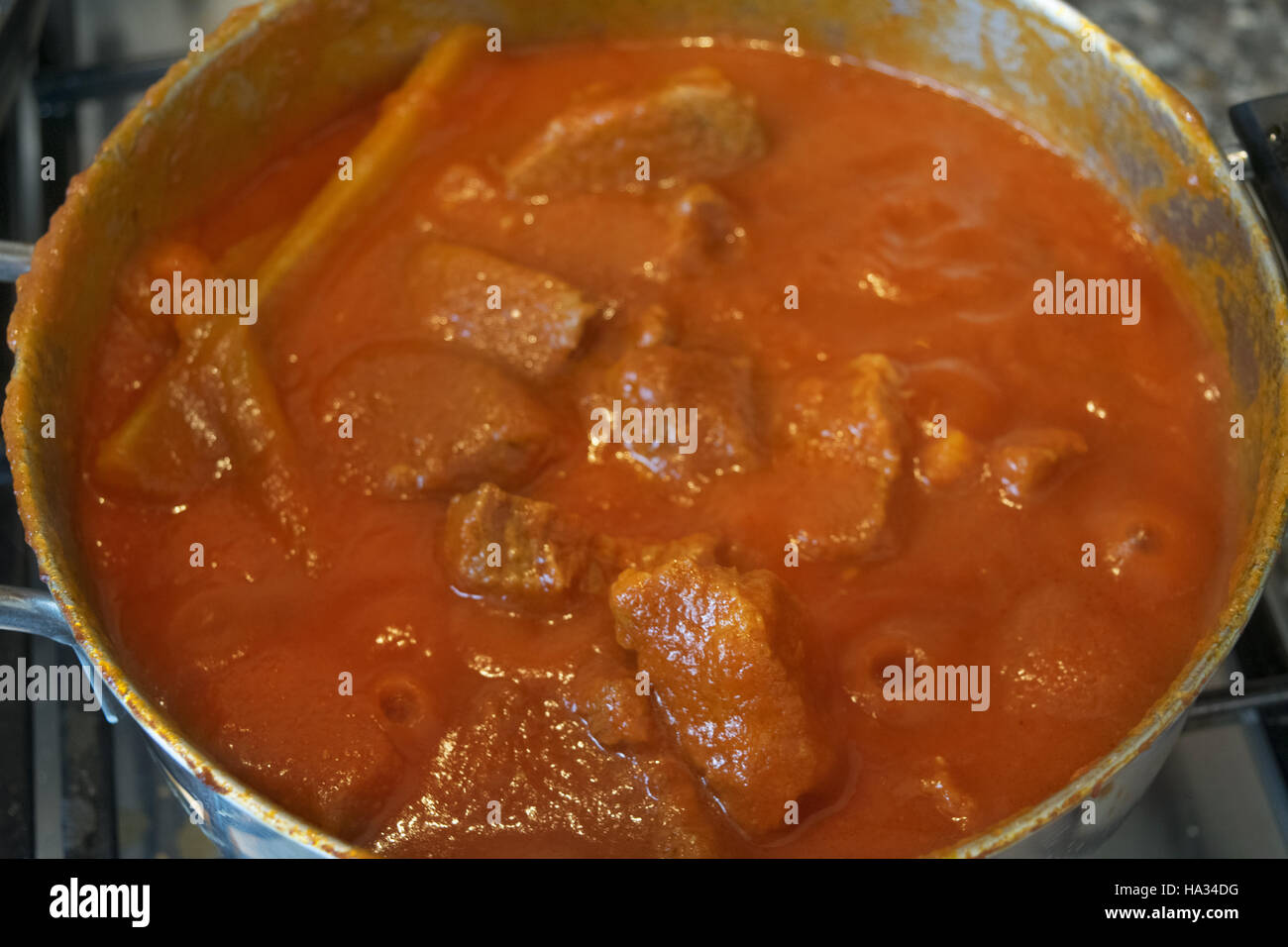 stew wild boar with tomato sauce at red wine Stock Photo - Alamy