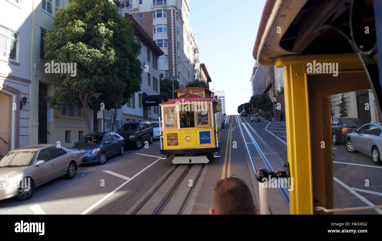 SAN FRANCISCO, USA - OCTOBER 5th, 2014: riding an Street cable car ...