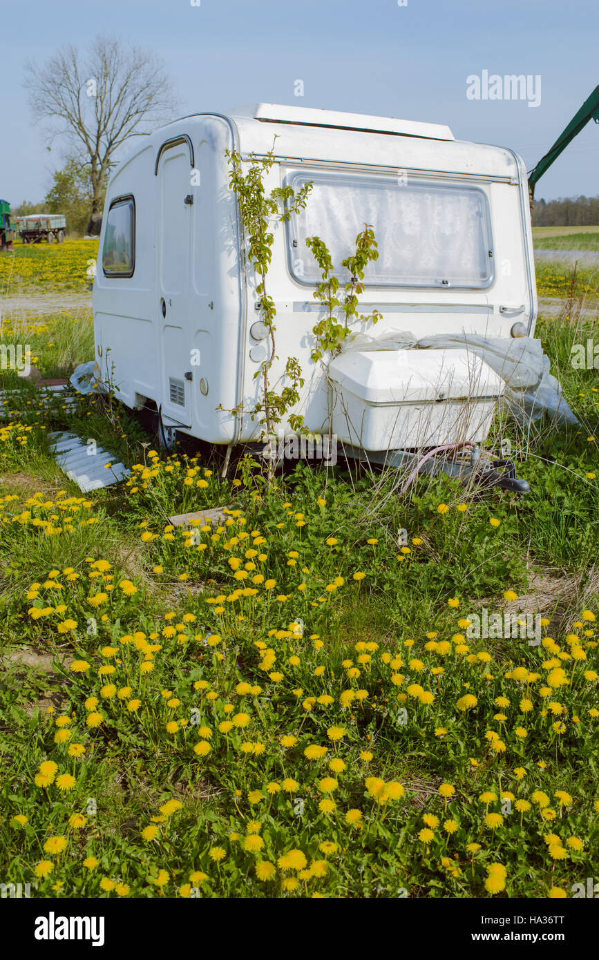 Old forgotten Travel trailer camping in spring Stock Photo - Alamy