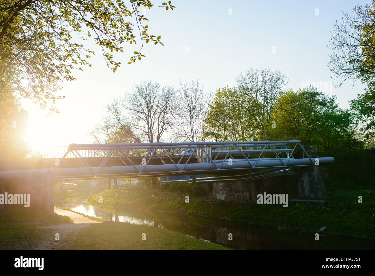 Small bridge in the city in spring Stock Photo - Alamy