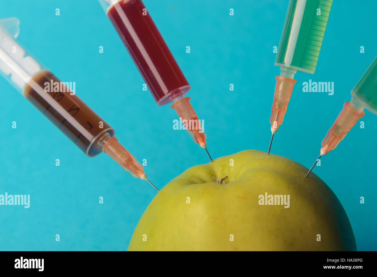 Chemical additives in food or genetically modified fruit concept. Green ...