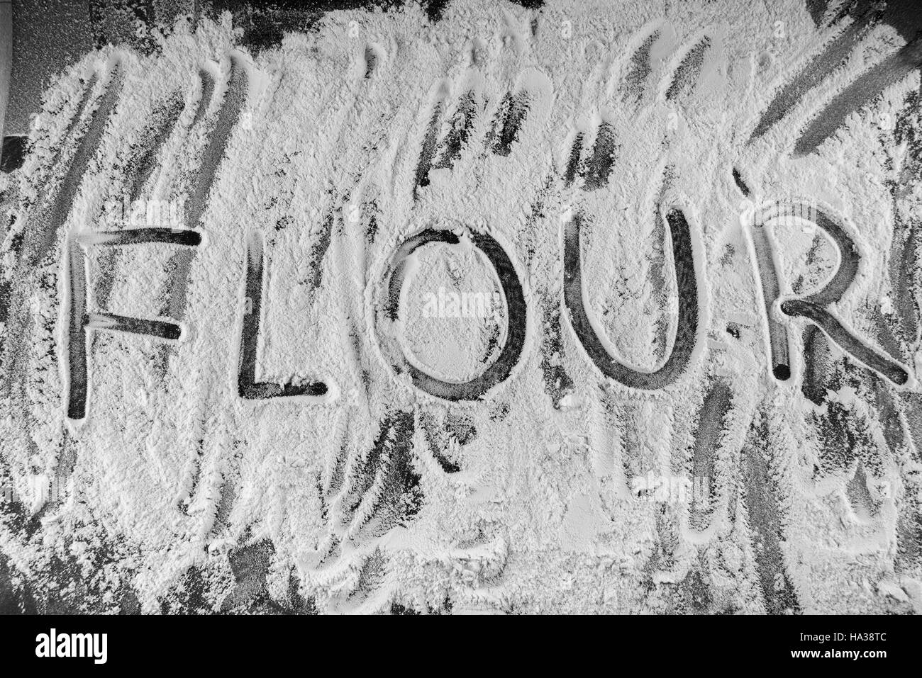 Word flour written in flour on table Stock Photo - Alamy