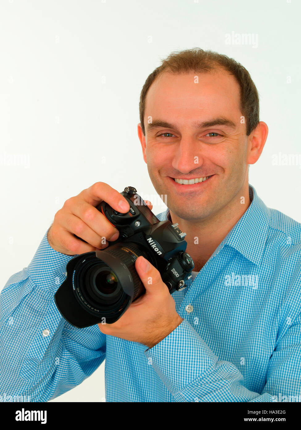 Photographer with a reflex camera Stock Photo - Alamy