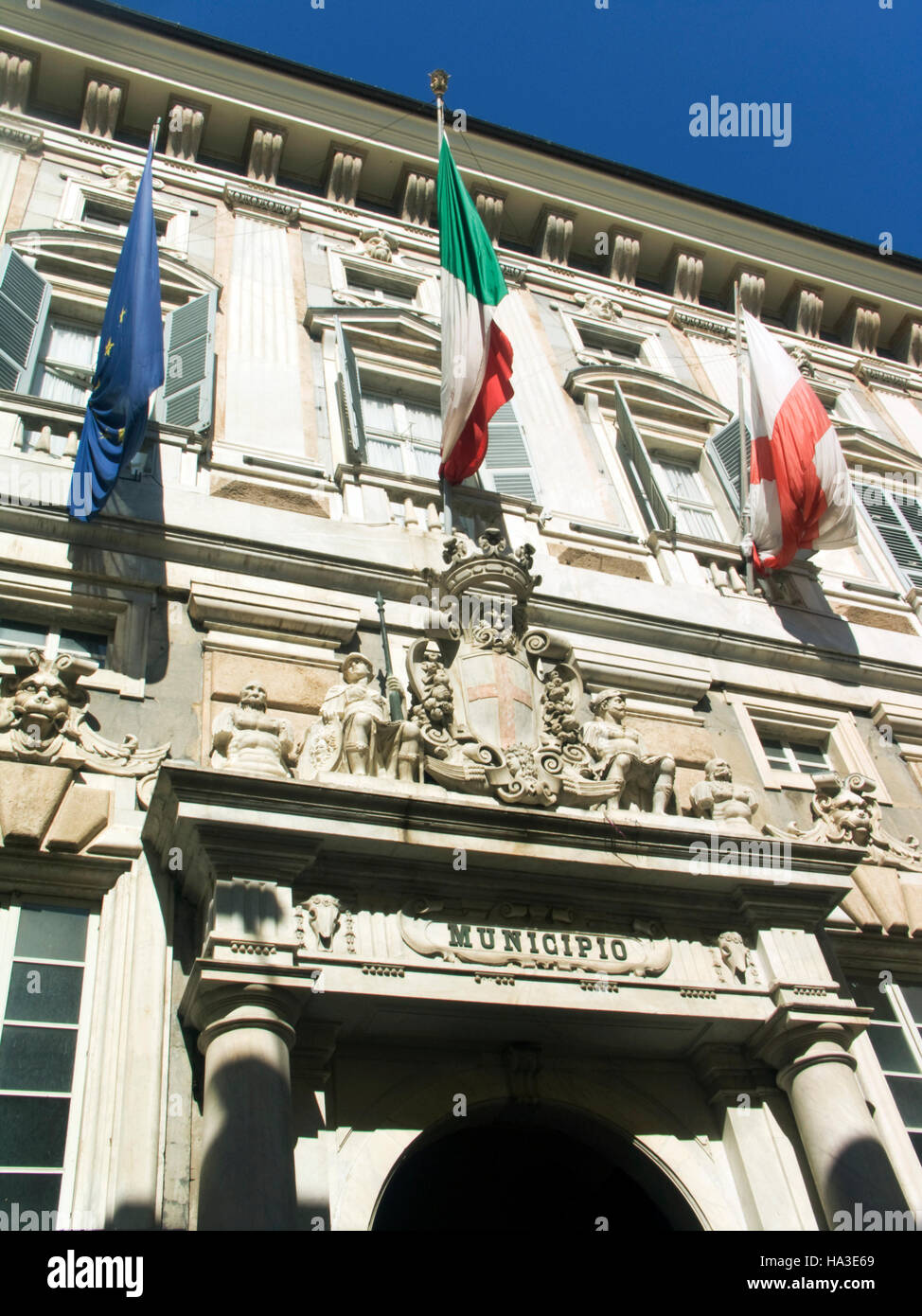 City Hall in Genoa, building entrance with flags, Province of Genoa ...