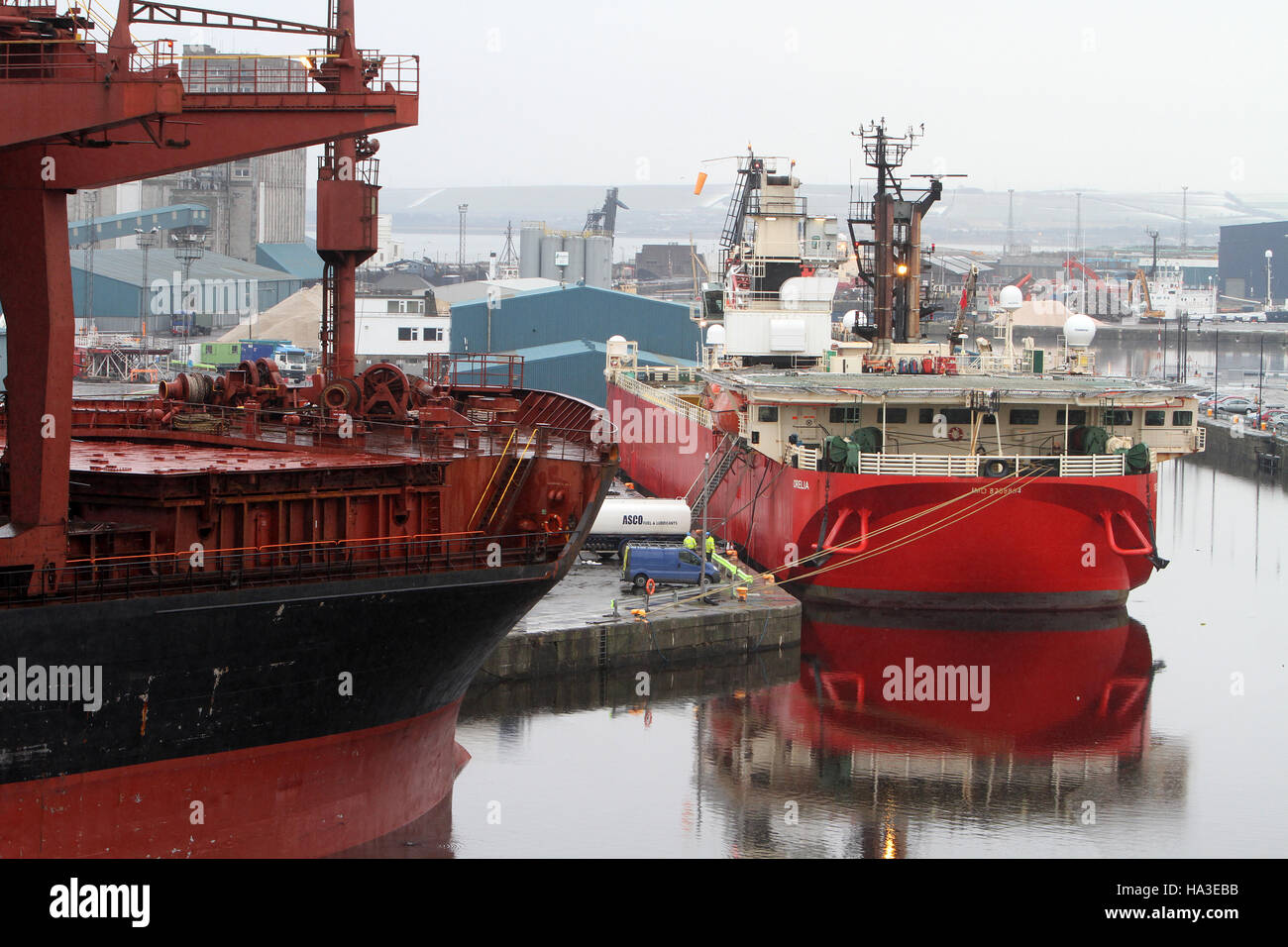 cargo ships unloading at docks Stock Photo - Alamy