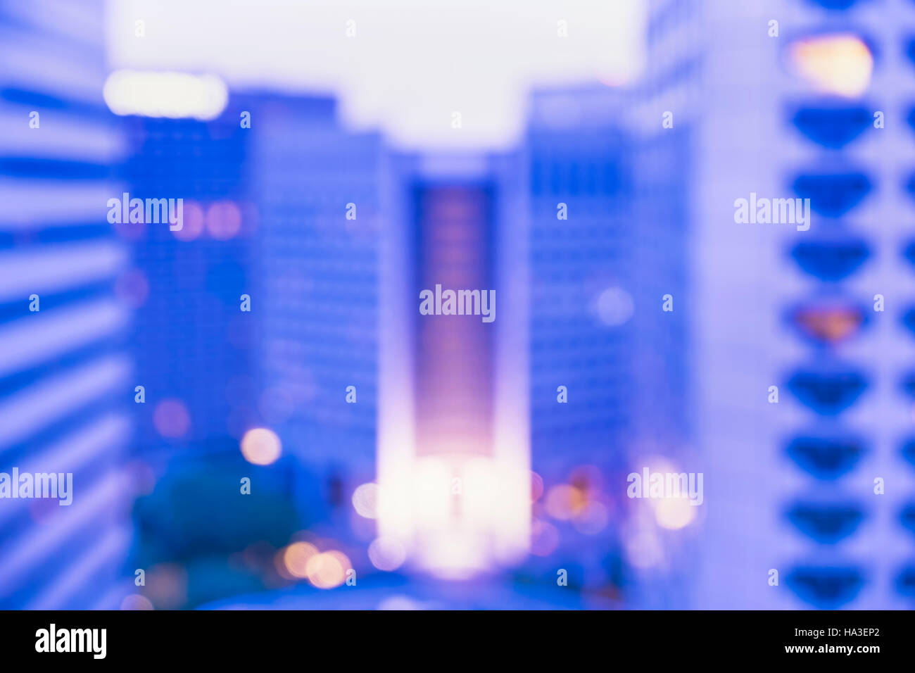 abstract light bokeh building on blue filter background - can use to ...