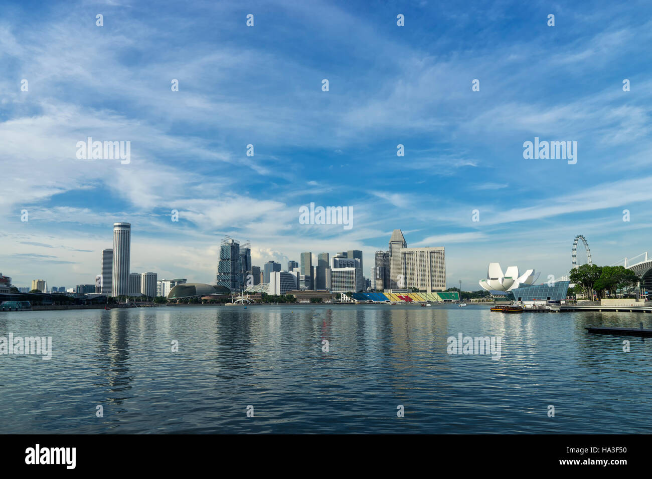abstract cityscape at waterfront in day time blue sky - can use to ...