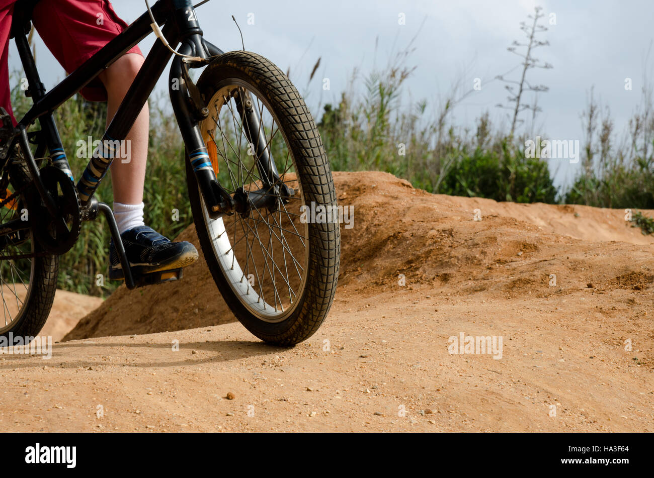 Front of bmx bike on dirt track Stock Photo - Alamy
