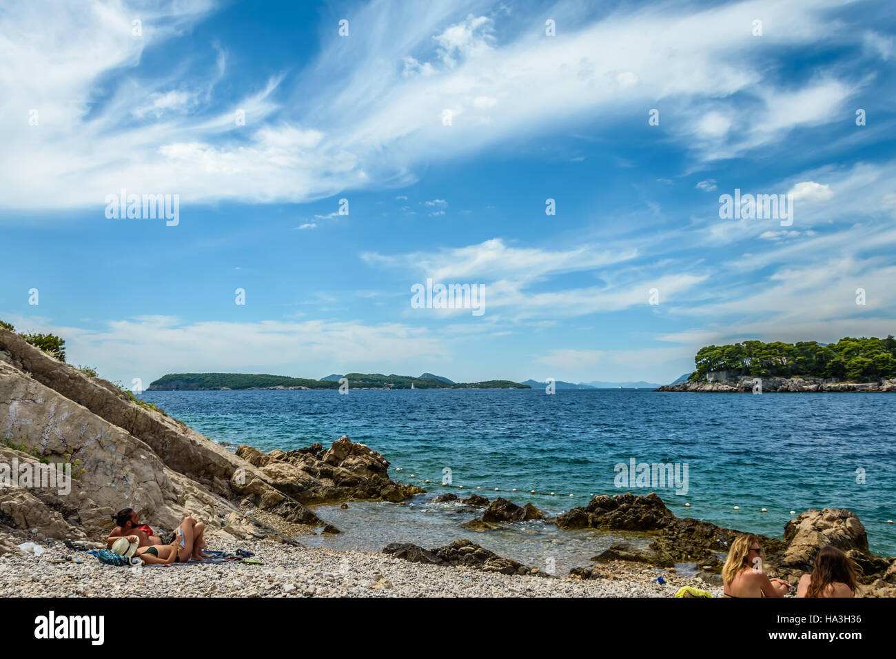 Clouds over the beach Stock Photo - Alamy
