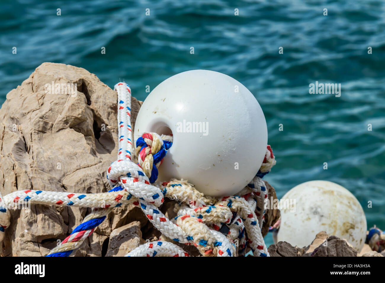 Floating the mark on the rock Stock Photo - Alamy