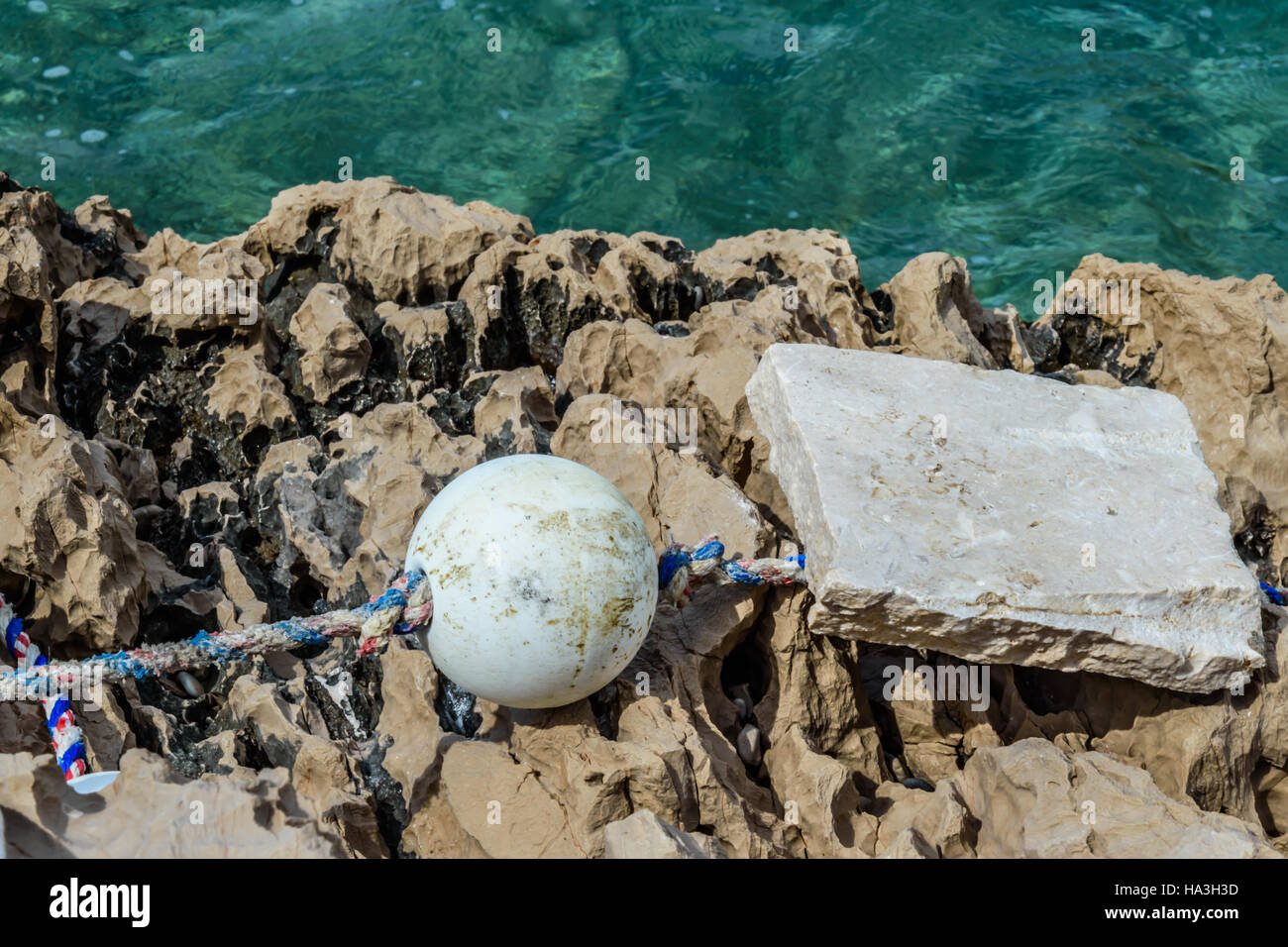 Floating the mark on the rock Stock Photo - Alamy