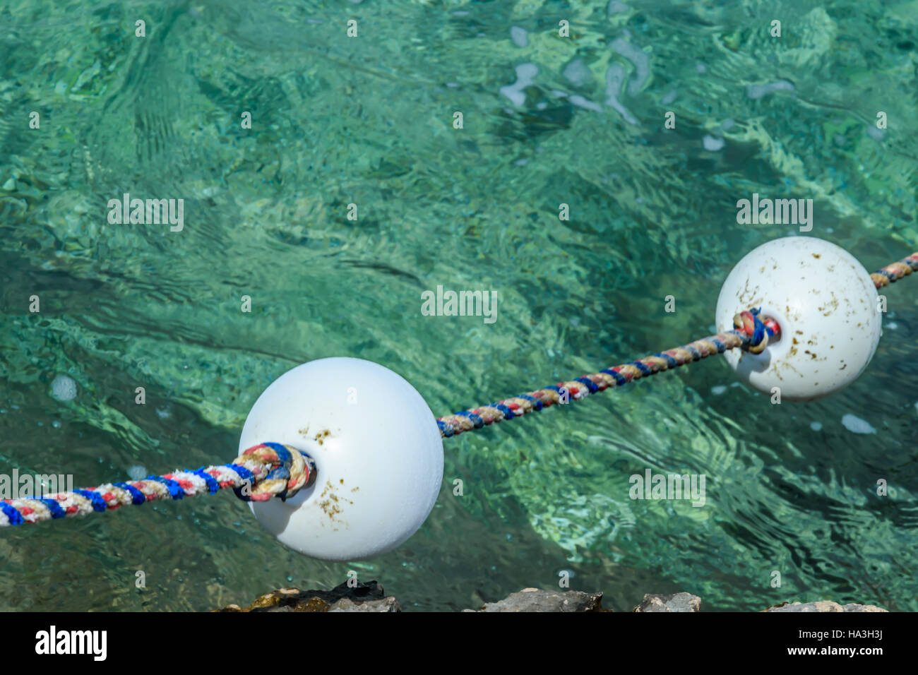 Floating the mark on the sea Stock Photo - Alamy