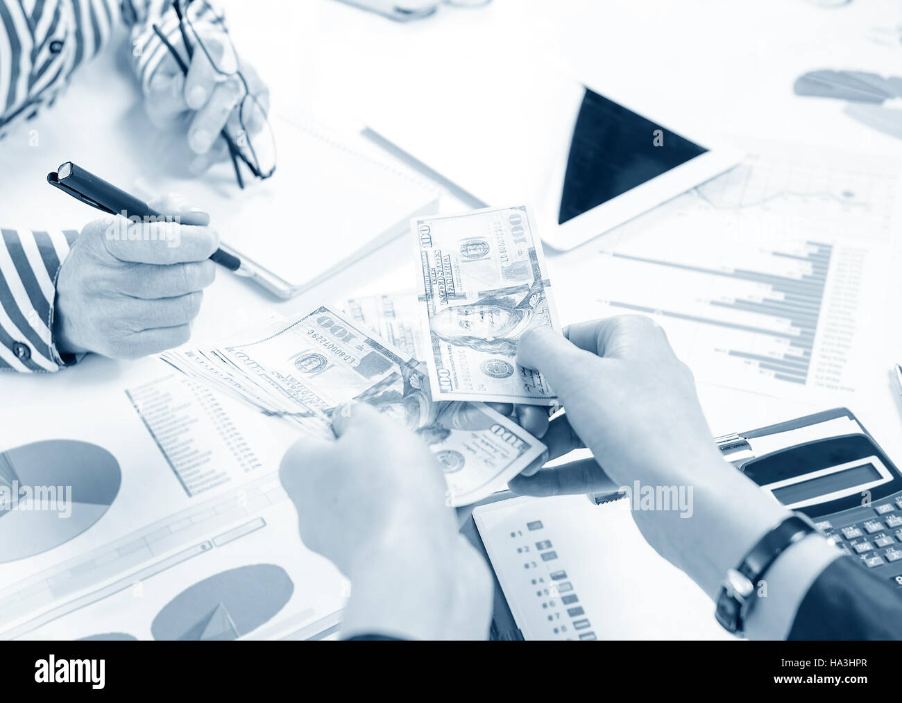 Business people exchanging dollar banknotes Stock Photo - Alamy