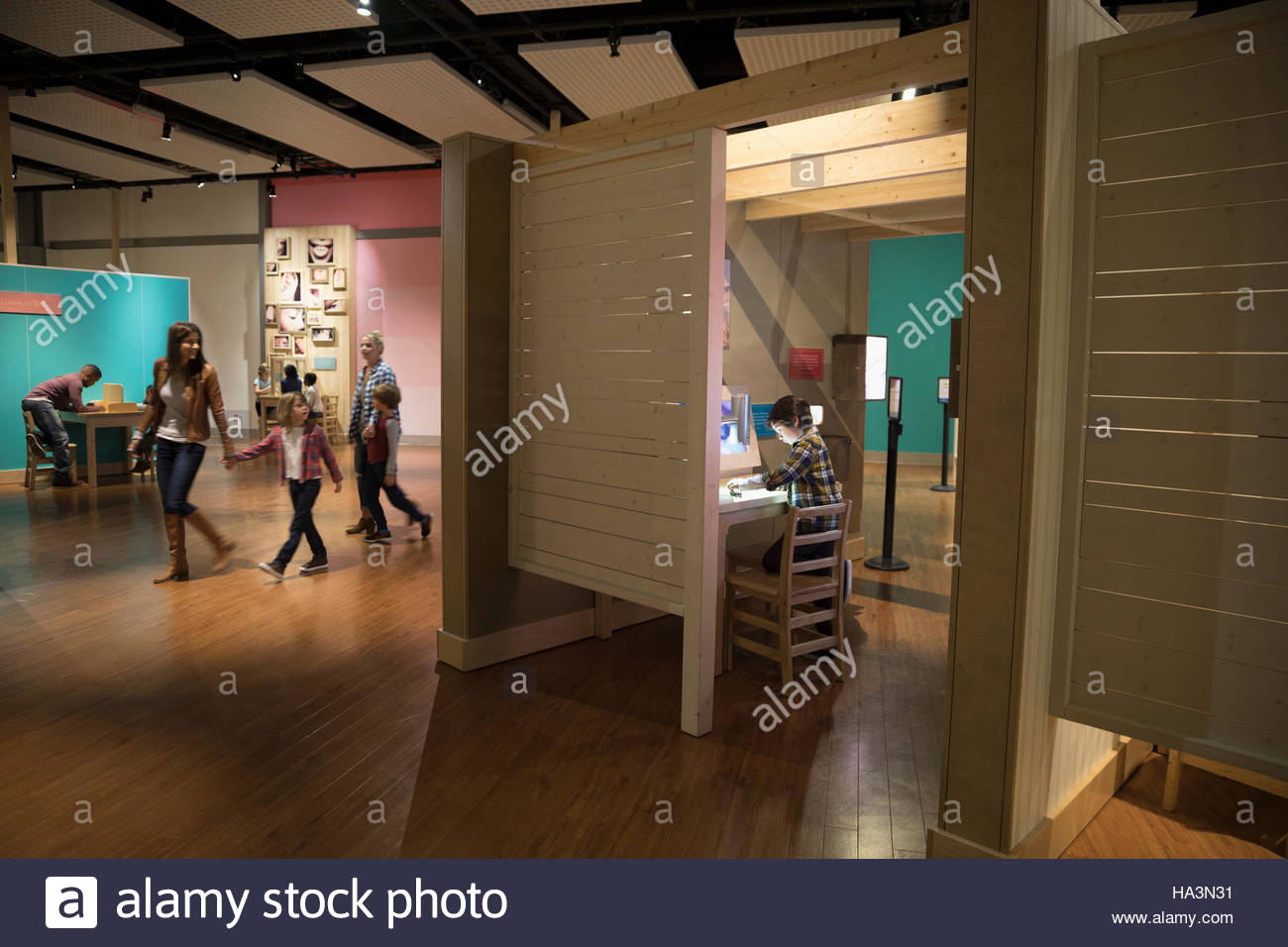 People enjoying exhibits in science center Stock Photo - Alamy