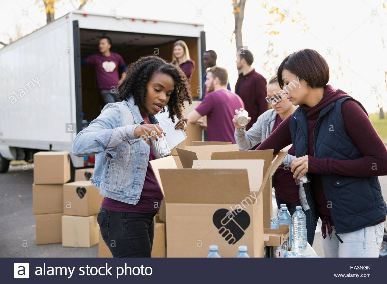 Adult african man packing boxes hi-res stock photography and images - Alamy