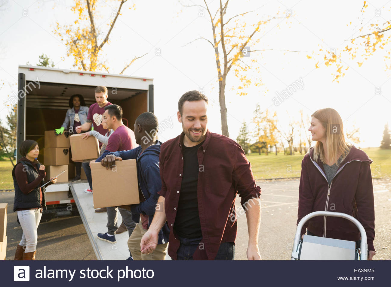 Men passing boxes hi-res stock photography and images - Alamy