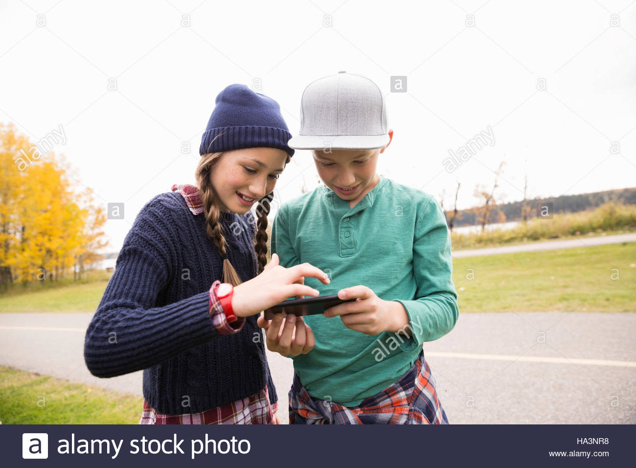 Standing holding receiving communication smiling childhood hi-res stock ...