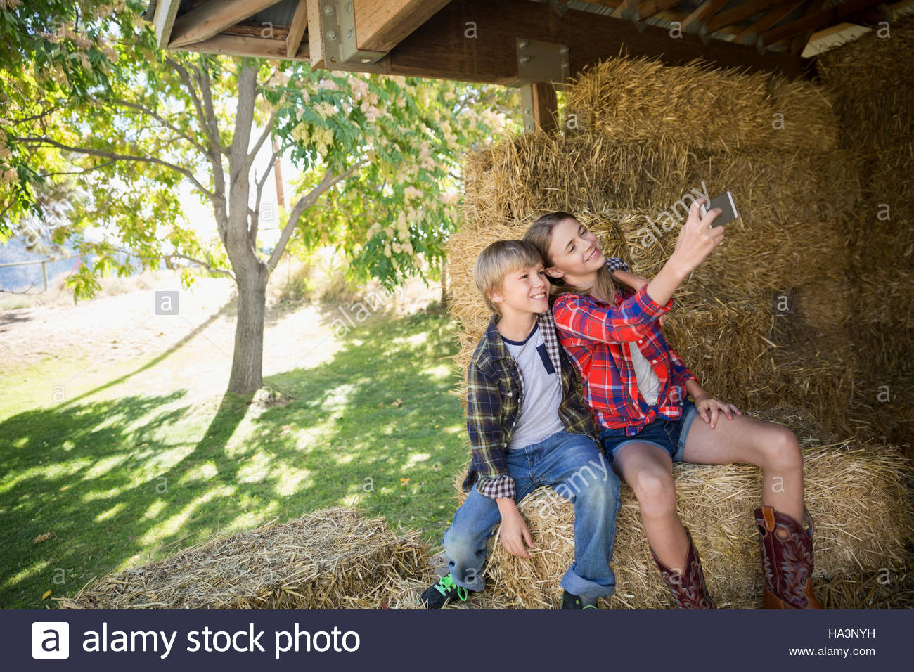 Boy girl in hay barn hi-res stock photography and images - Alamy