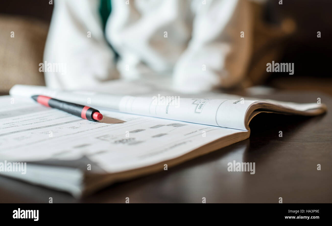 Child do his homework. Notebook for mathematic. Hand hold pen. Boy ...