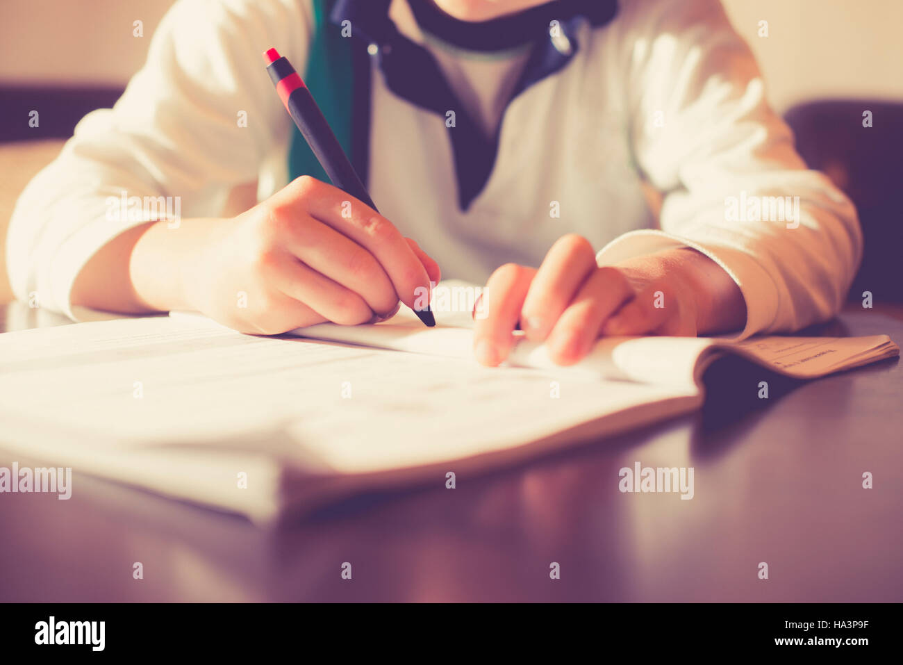 Kids doing homework table hi-res stock photography and images - Alamy
