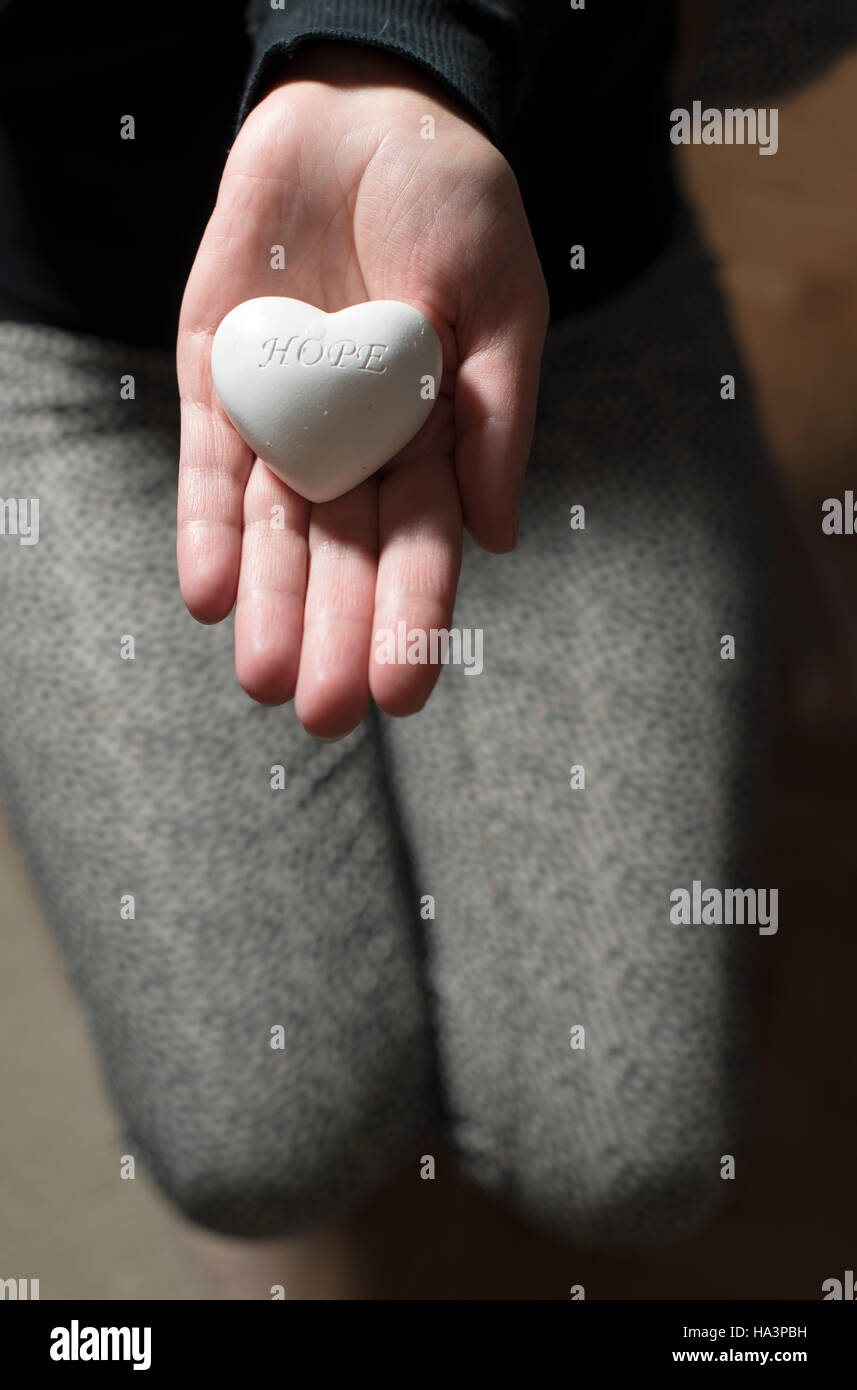 Woman hold in hands heart. Help concept and expectation Stock Photo - Alamy