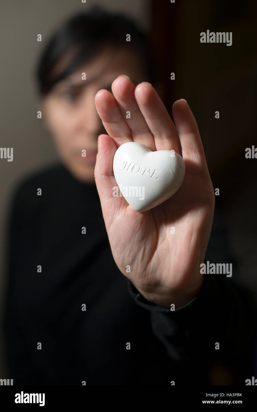 Woman hold in hands heart. Help concept and expectation Stock Photo - Alamy