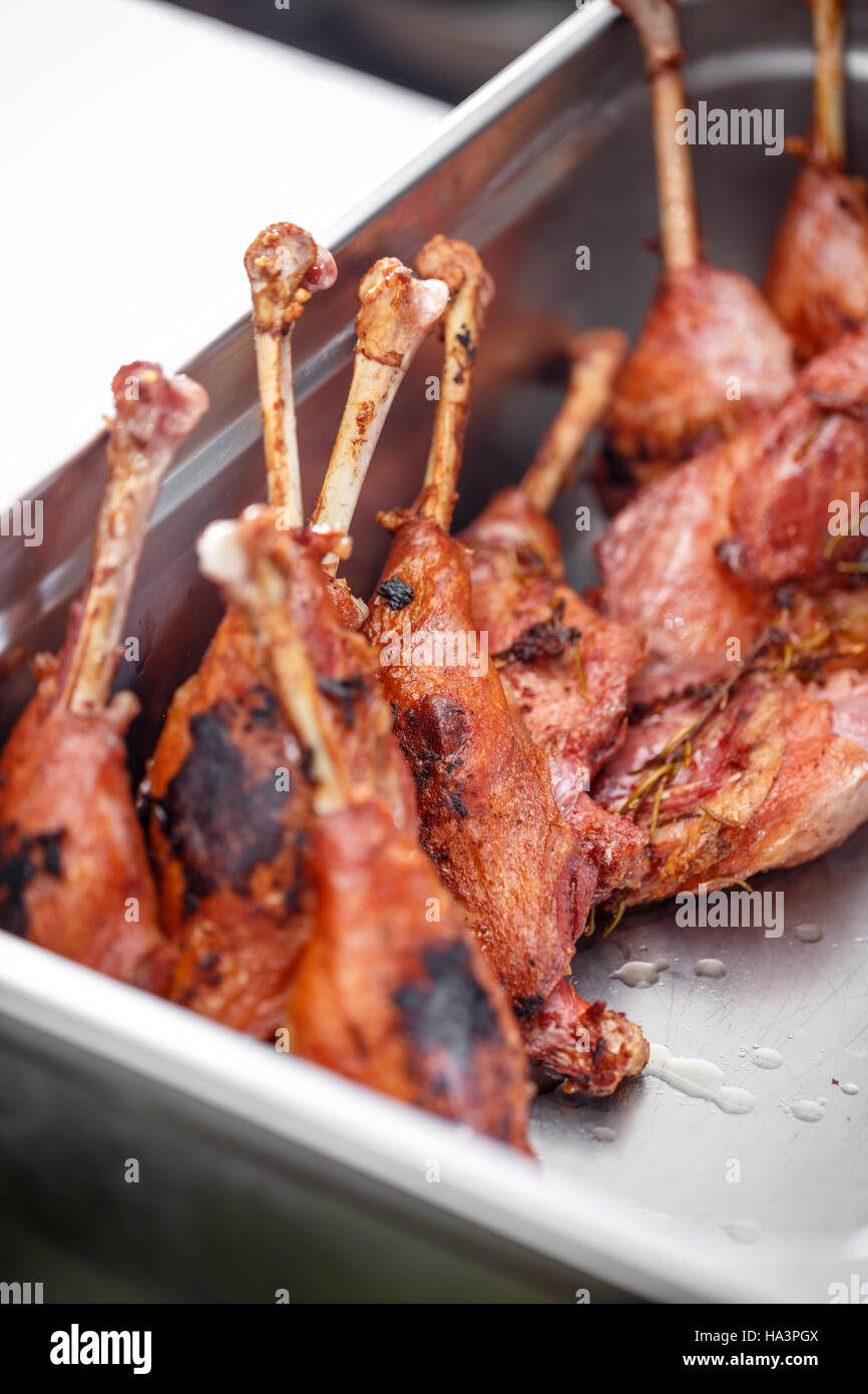 Roasted goose legs in pan, restaurant kitchen Stock Photo - Alamy
