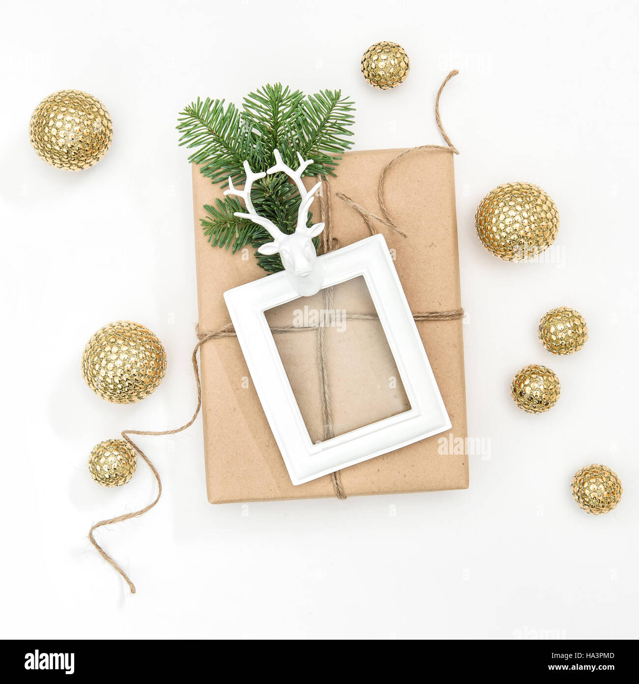 Christmas composition with wrapped gift and picture frame on white ...
