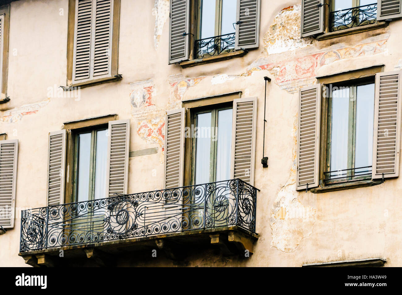 Buildings with shuttered windows and traditional Italian wrought iron ...
