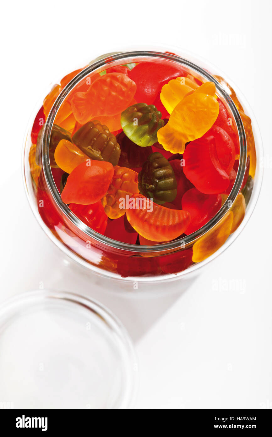 Wine gums in an opened jar Stock Photo - Alamy