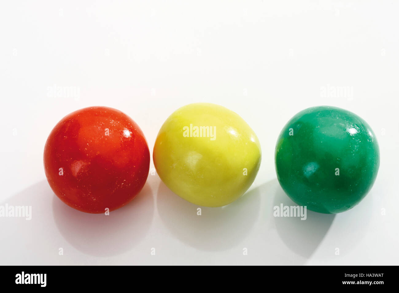 A red, a yellow and a green gumball Stock Photo - Alamy