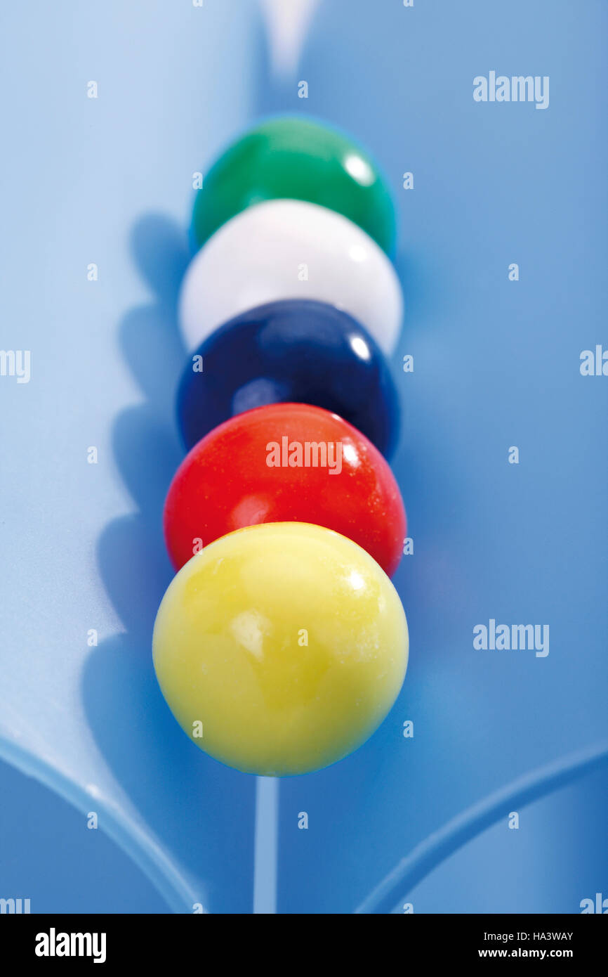 Multicoloured gumballs in a row Stock Photo - Alamy