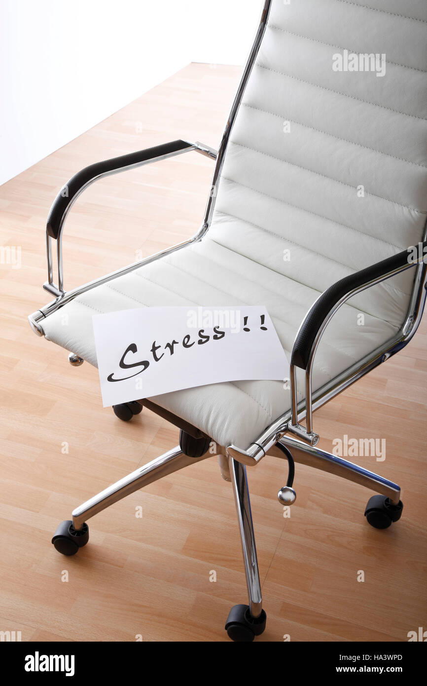 White office chair, "stress" in writing Stock Photo - Alamy