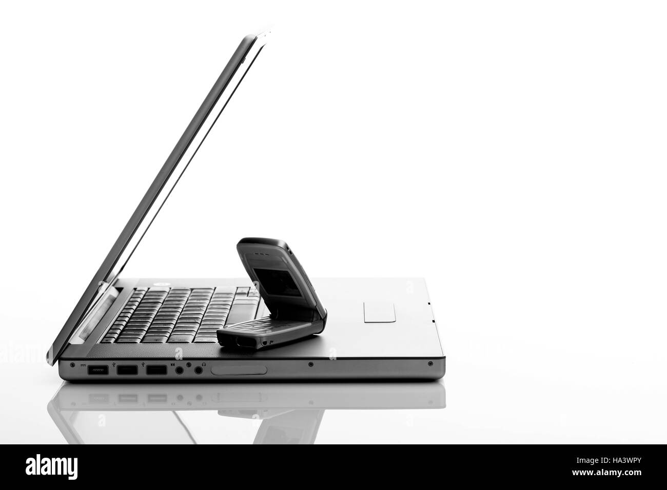 Laptop computer mobile cell Black and White Stock Photos & Images - Alamy