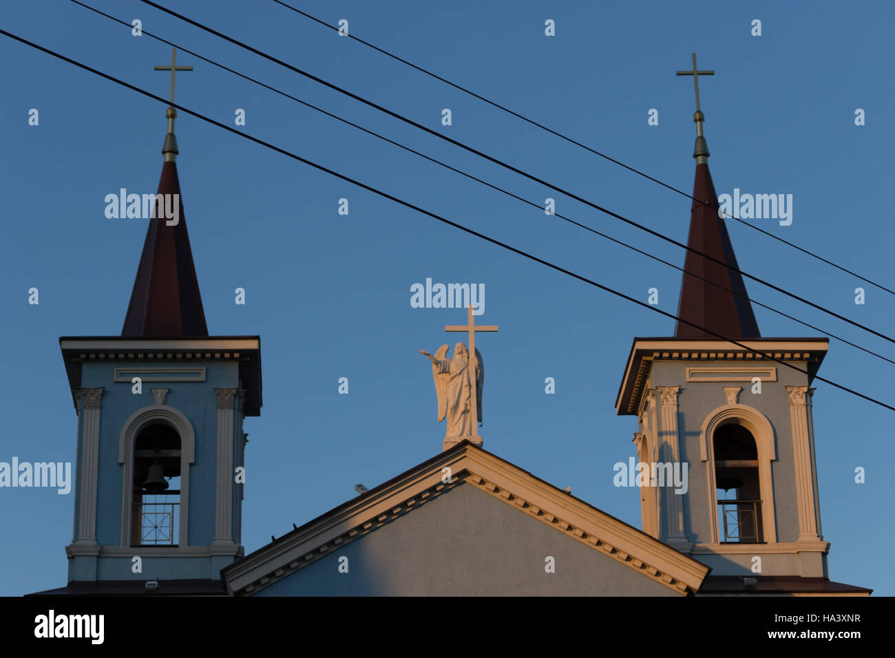 roof of a blue catholic church with angel statue Stock Photo - Alamy
