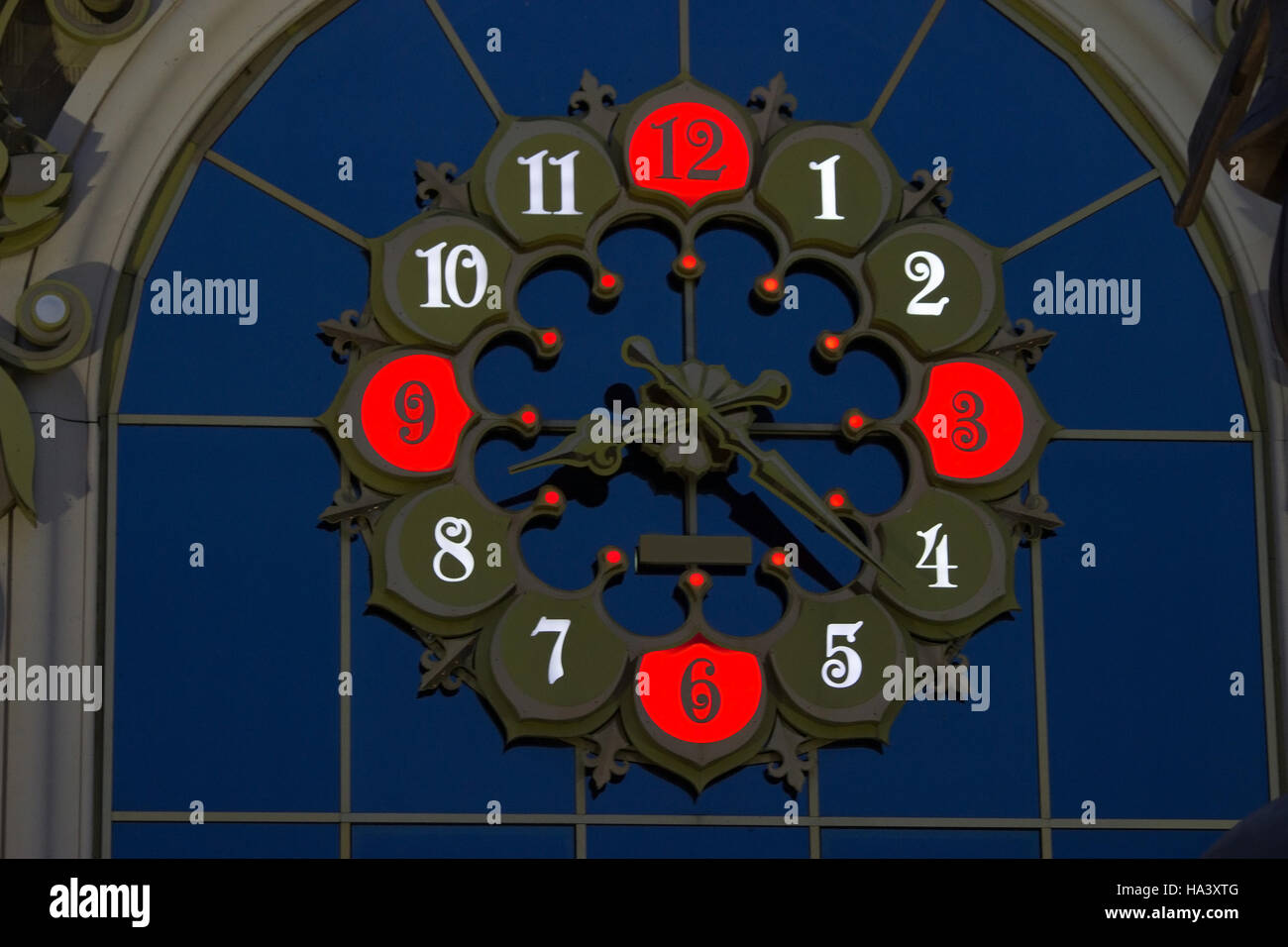 colorful illuminated clock with red numbers, night Stock Photo - Alamy