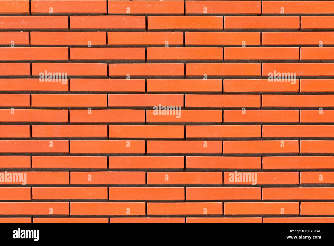 background old brick wall with the orange paint Stock Photo - Alamy