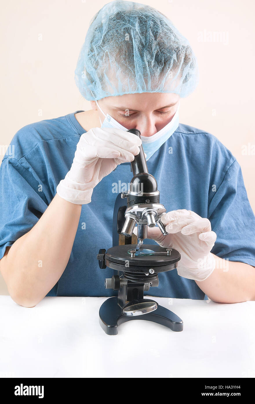 Close up of a scientist looking into a microscope in a laboratory Stock ...