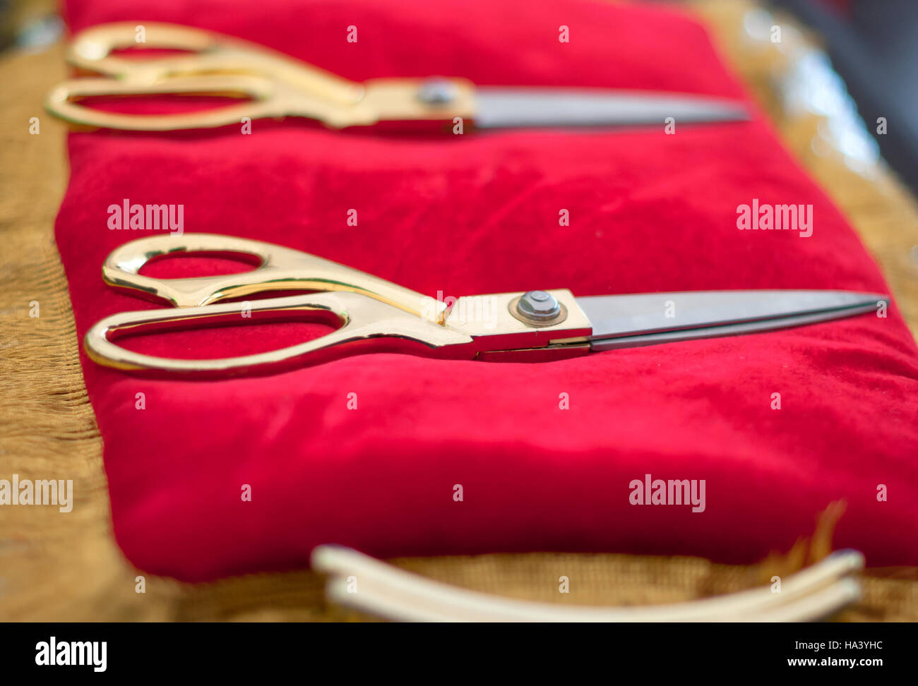 scissors on a red pillow. A close up Stock Photo - Alamy