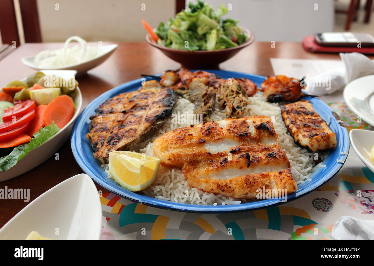 Middle Eastern grilled fish at a restaurant in Sharjah Stock Photo - Alamy