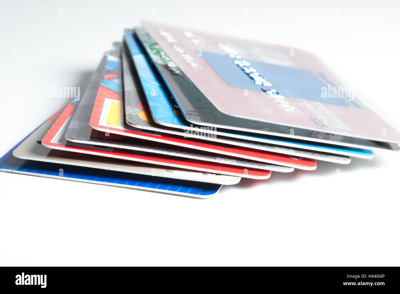 Stack of credit cards with MasterCard,American express and Visa logos ...